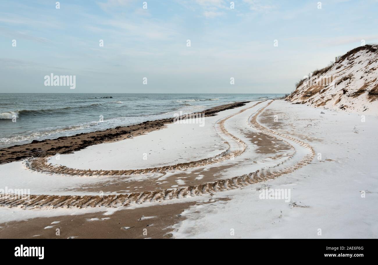 Snowy coast of Baltic sea with tractor trail Stock Photo - Alamy