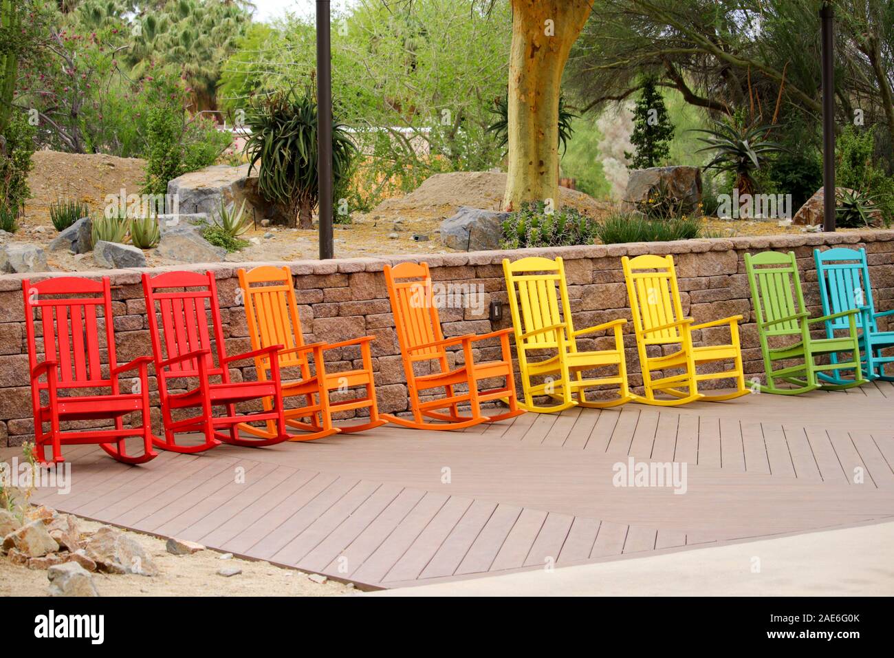 Row colorful wooden chairs hi-res stock photography and images - Alamy