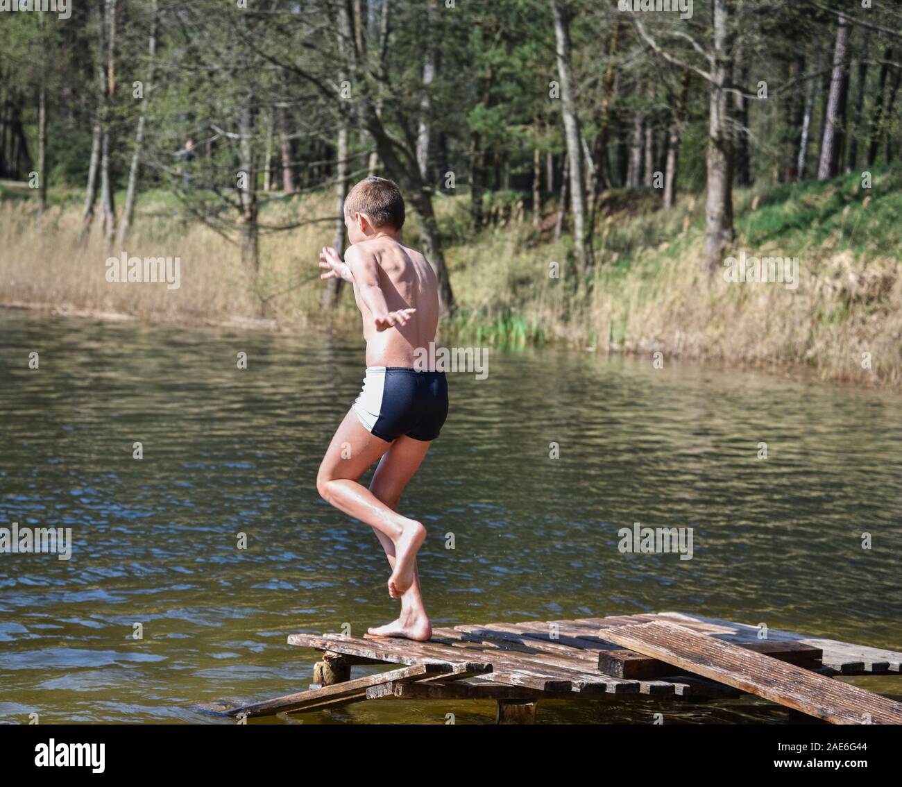 Kid Jumping Back View High Resolution Stock Photography and Images - Alamy