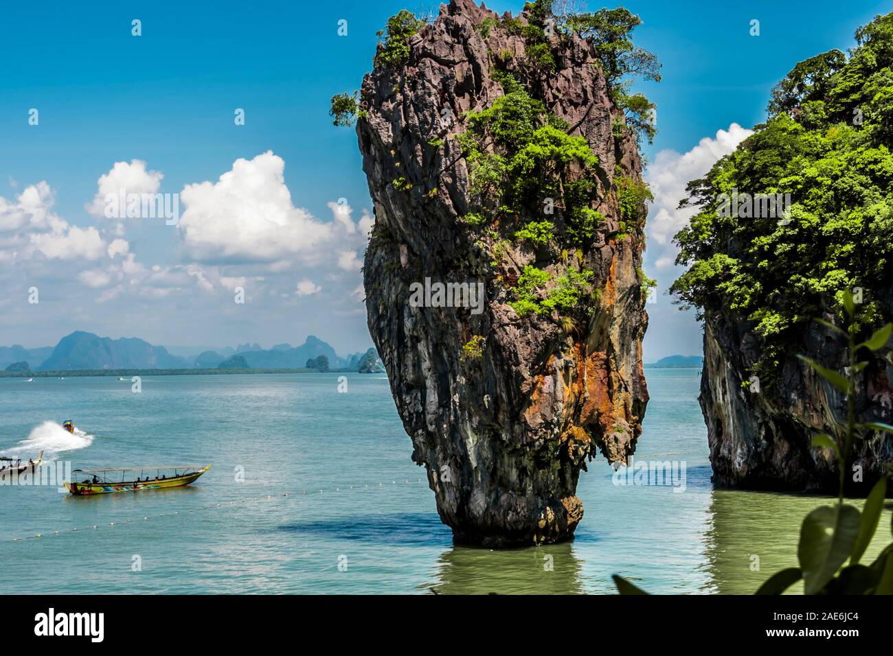 Close-up of karst limestone tower emerging from the Andaman Sea in the ...