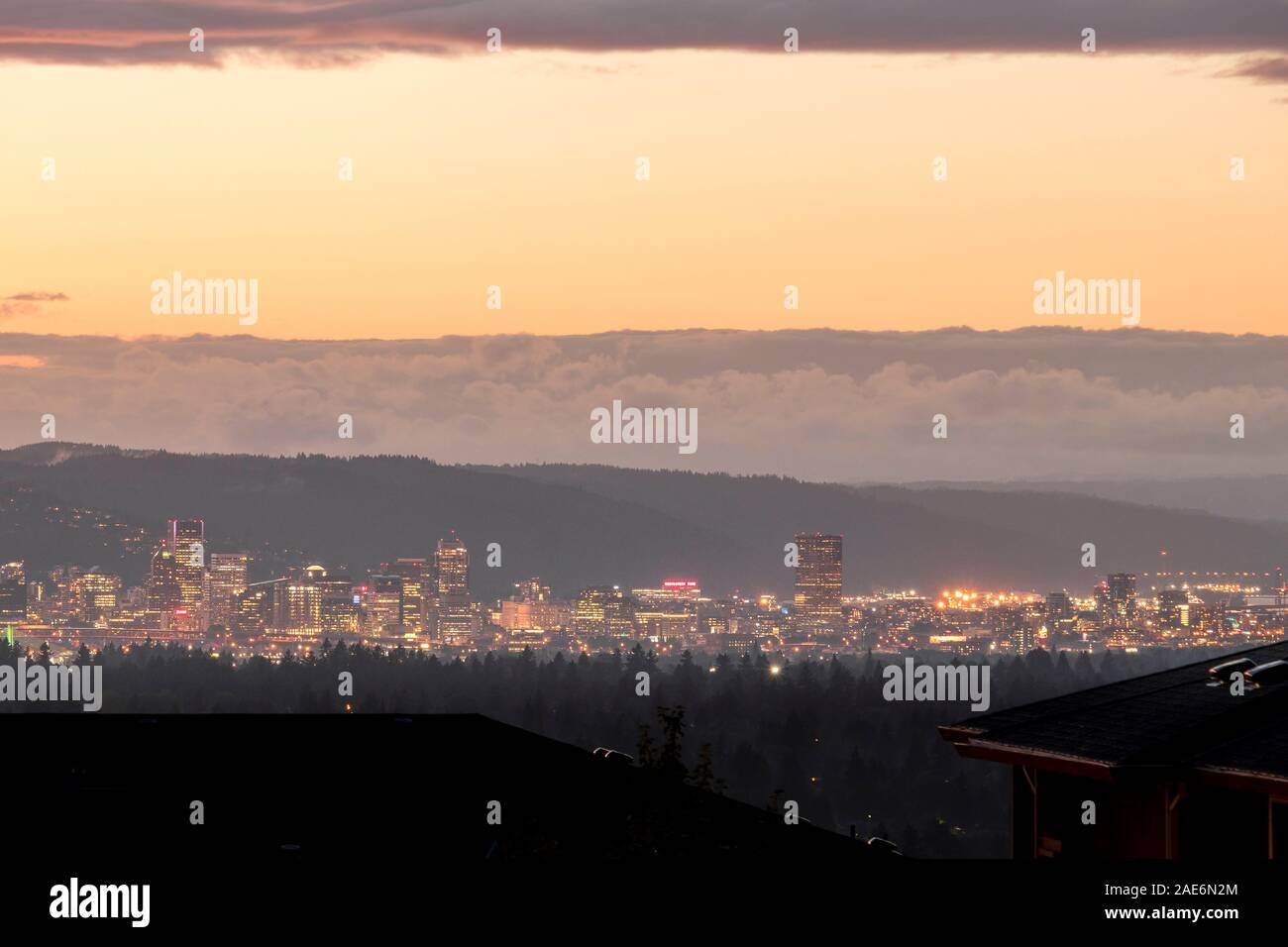 Night coming over Portland Oregon and building lights turning on in ...