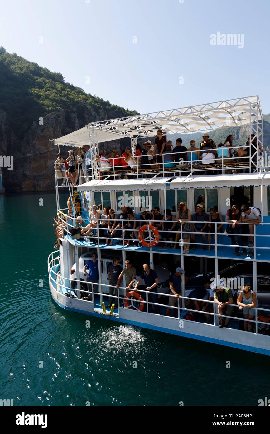 Koman, Albania, July 7 2019: Ferry is loaded with cars and passengers ...