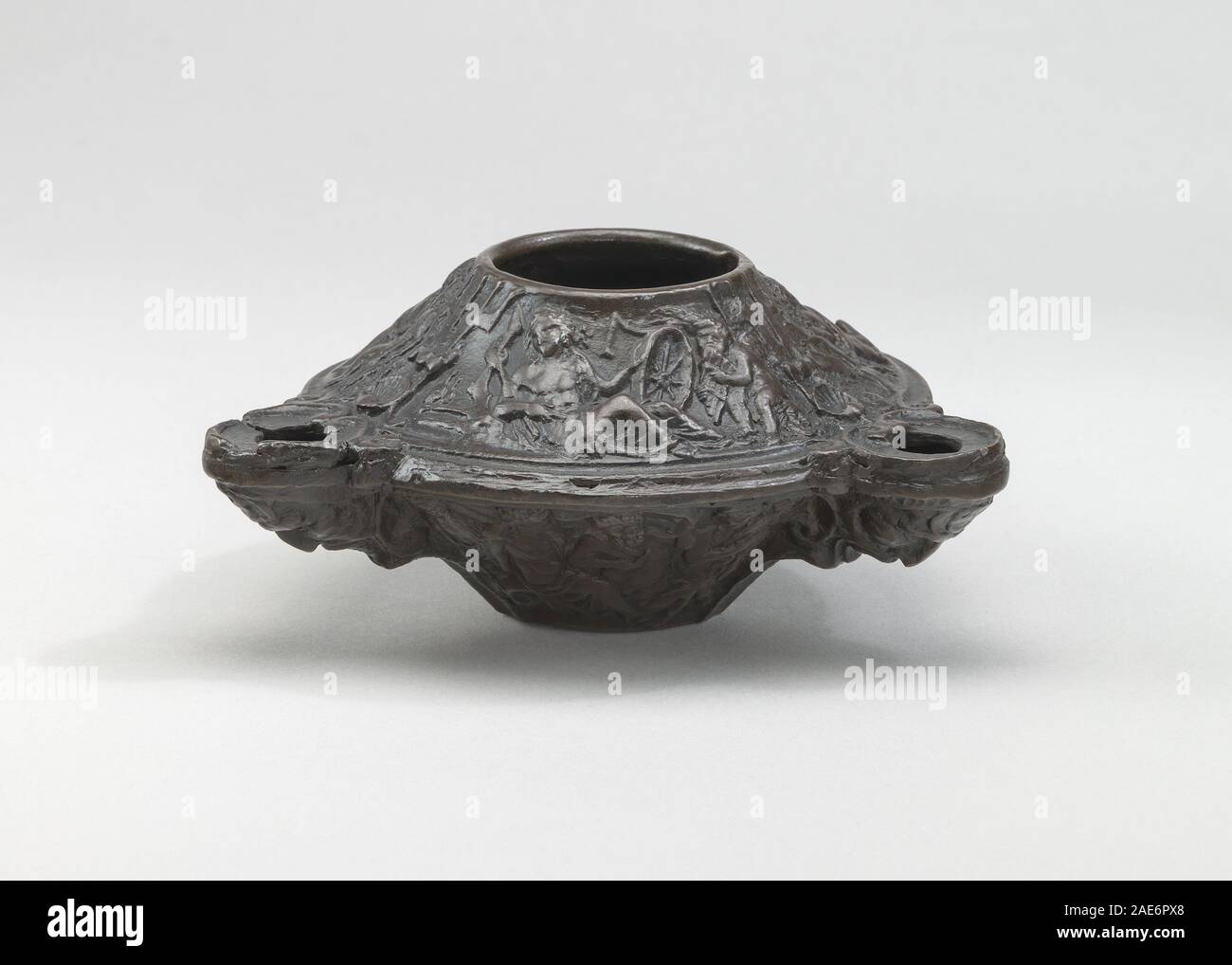 A three-wick lamp by Andrea Briosco (Riccio) showing Bacchic ...