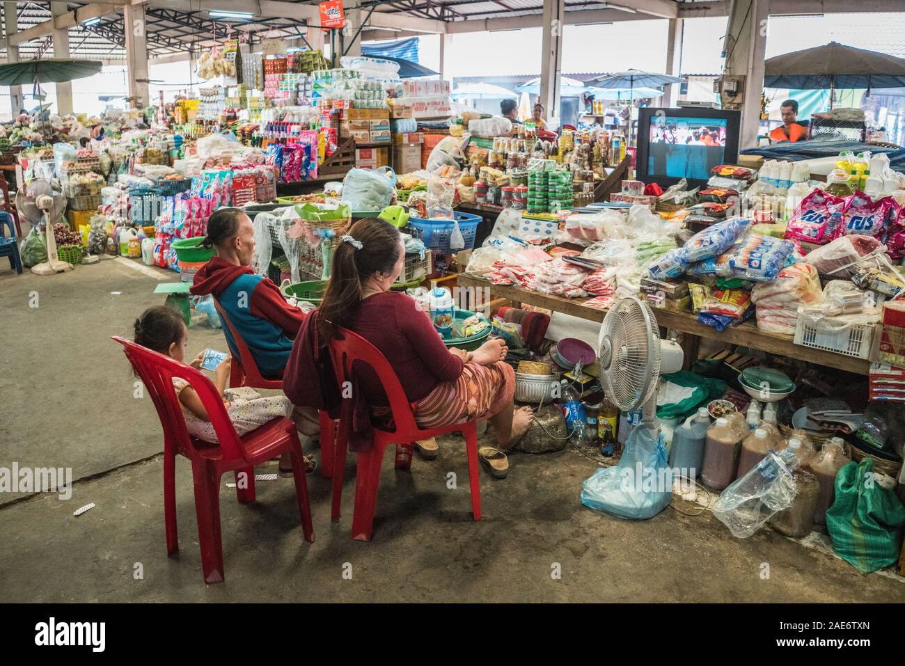 Local people looking on the tv in the market, Pakse, Laos, Asia Stock ...