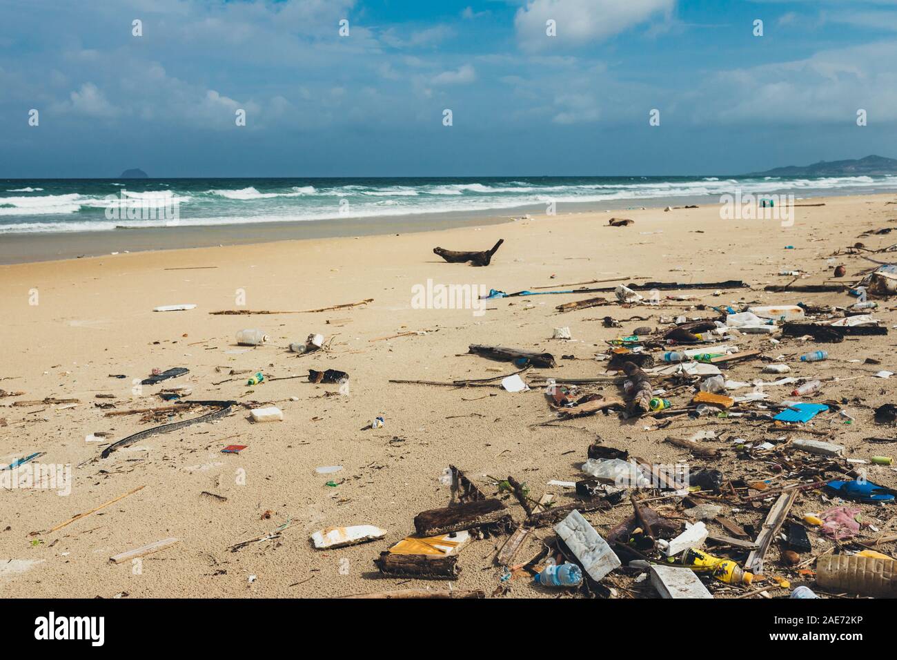 Garbage on the shore of a beautiful sea beach, environmental pollution ...