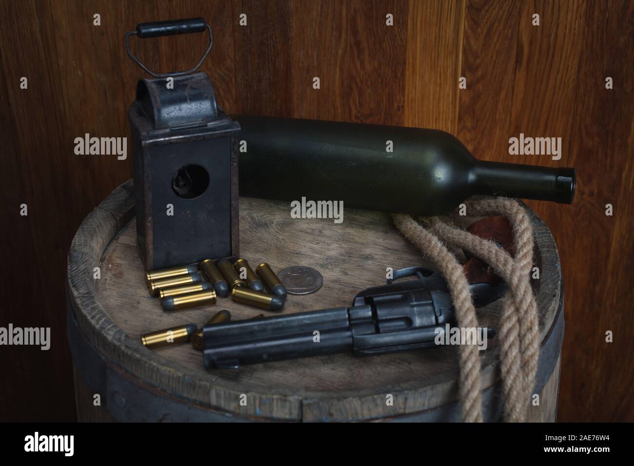 Old western revolver with cartridges on wooden barrel Stock Photo - Alamy
