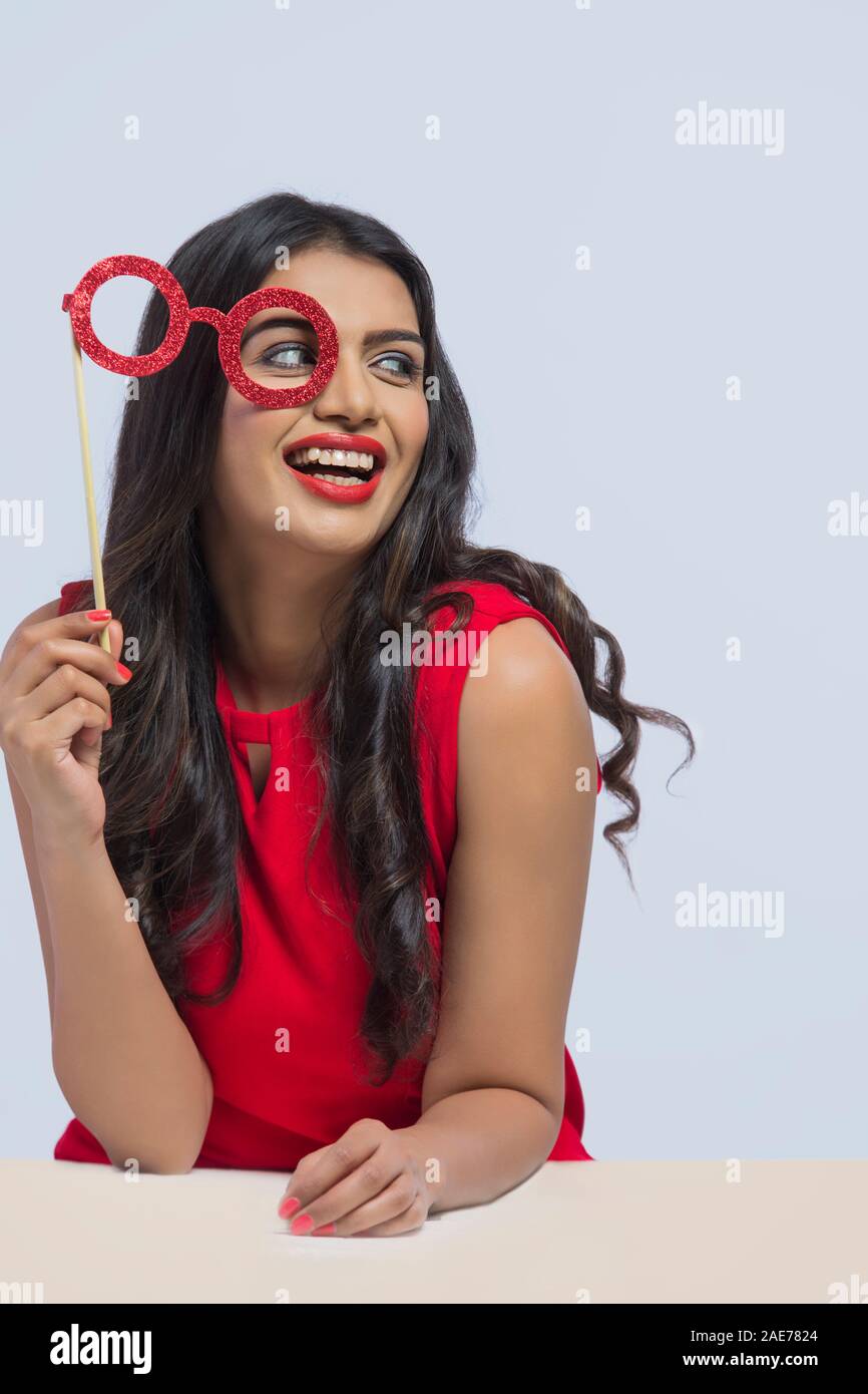 Portrait of a young woman with an eye mask prop Stock Photo - Alamy