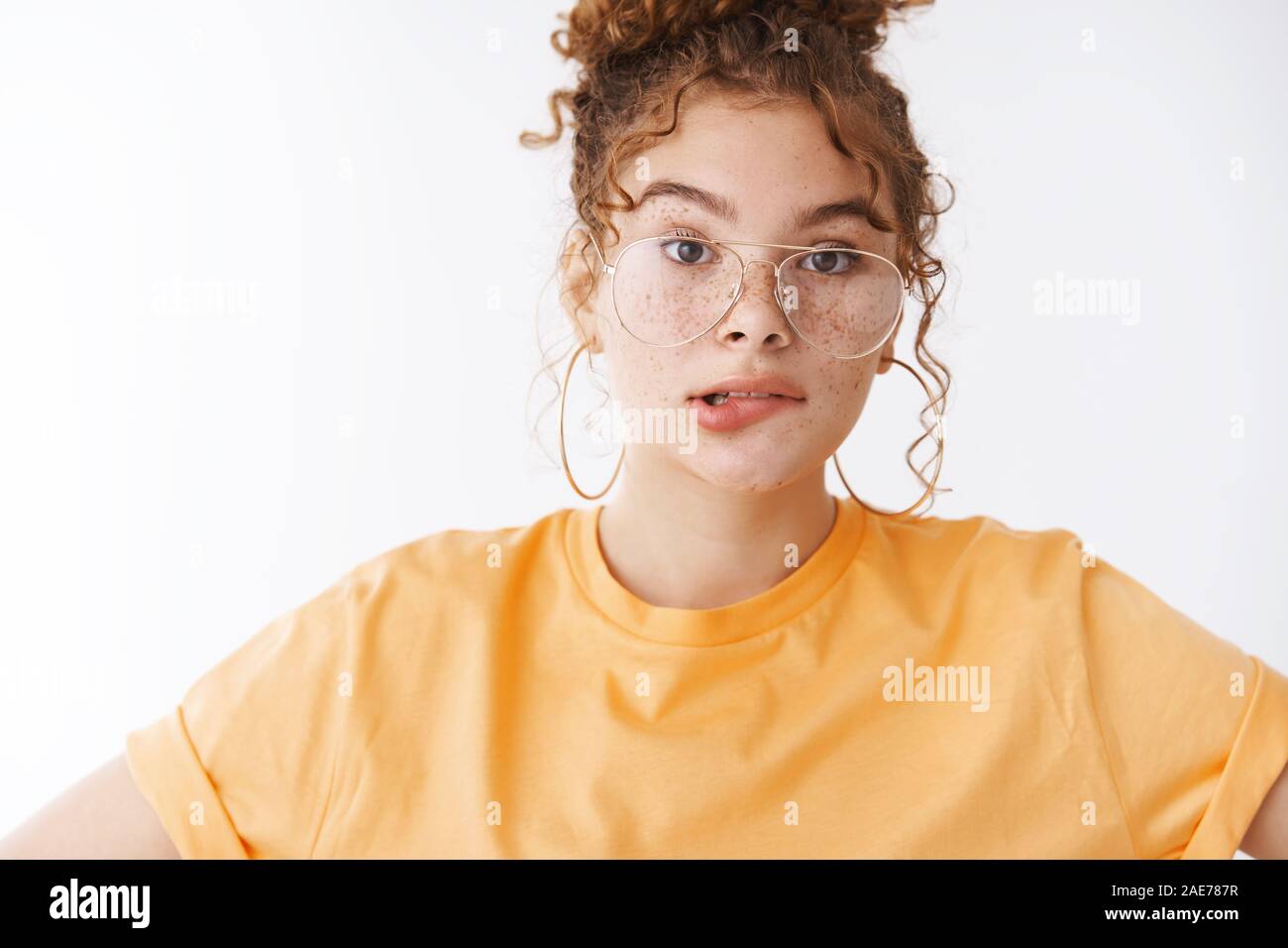 Perplexed troubled cute ginger girl trying solve problematic situation ...