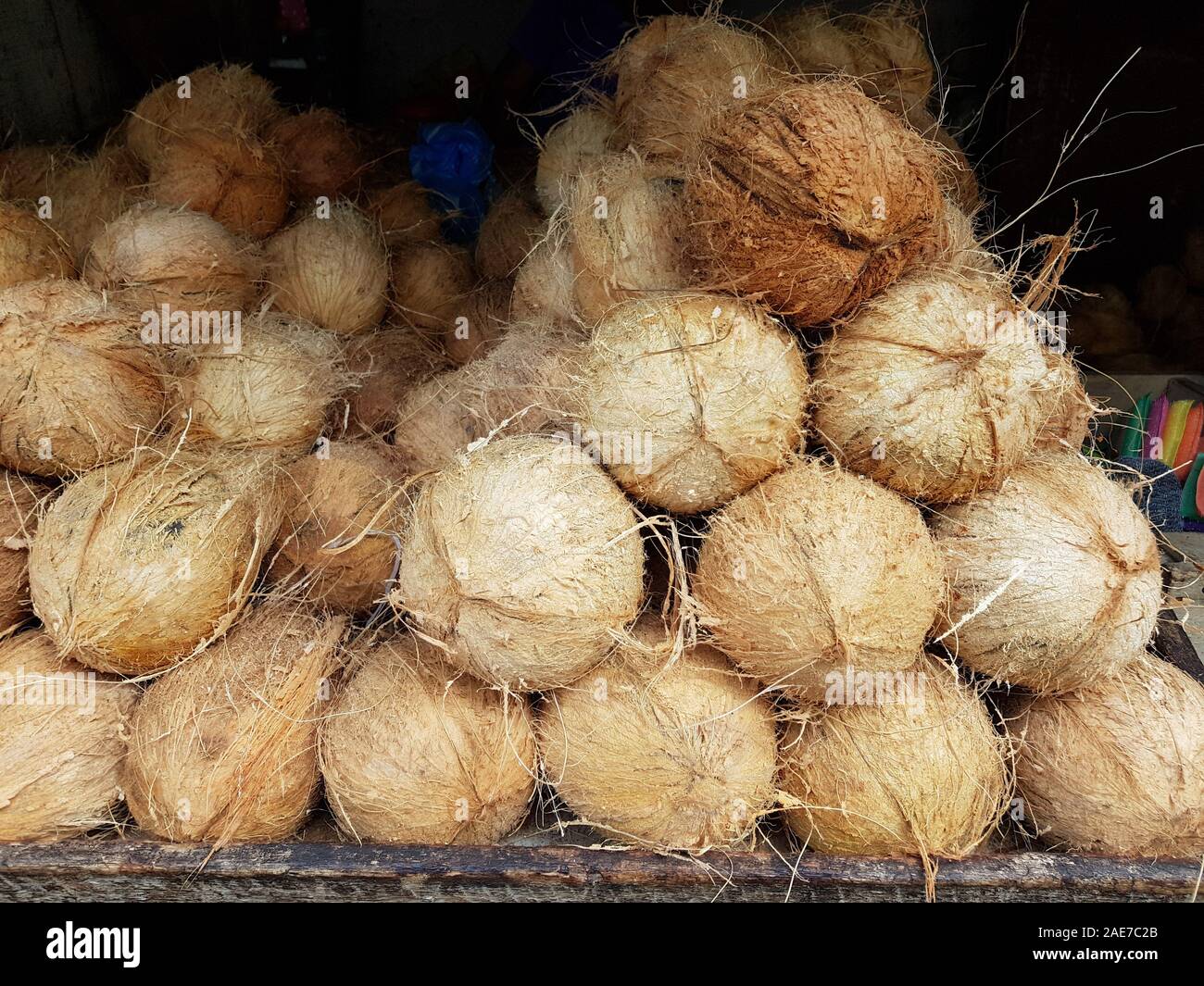Pile of coconuts stacked at a local market of fruit and vegetable in ...