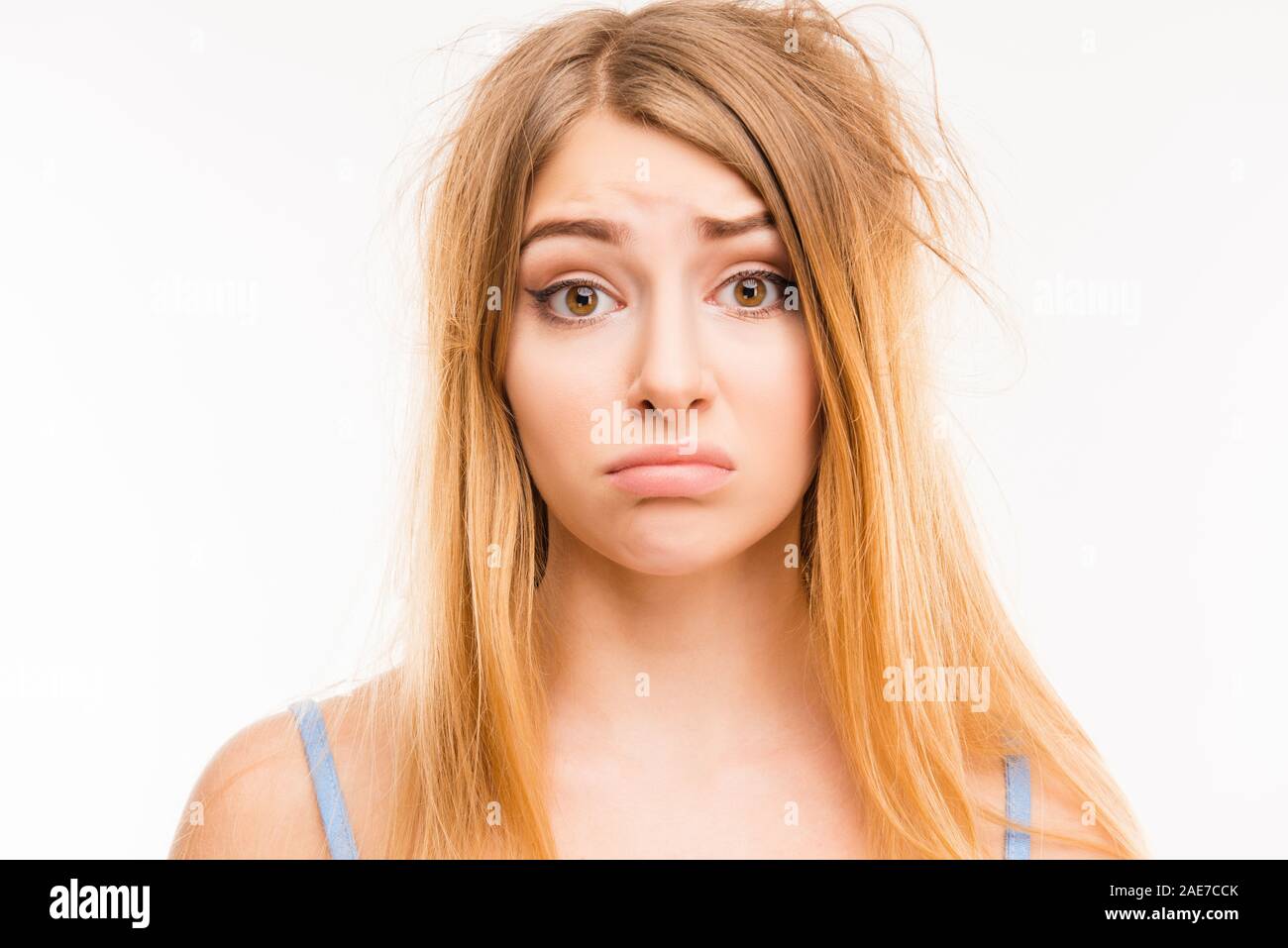 Upset girl with problem hair Stock Photo - Alamy