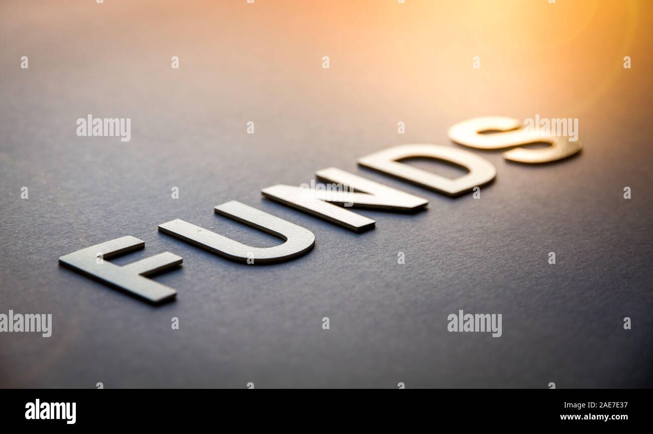 Word funds written with white solid letters on a board Stock Photo - Alamy