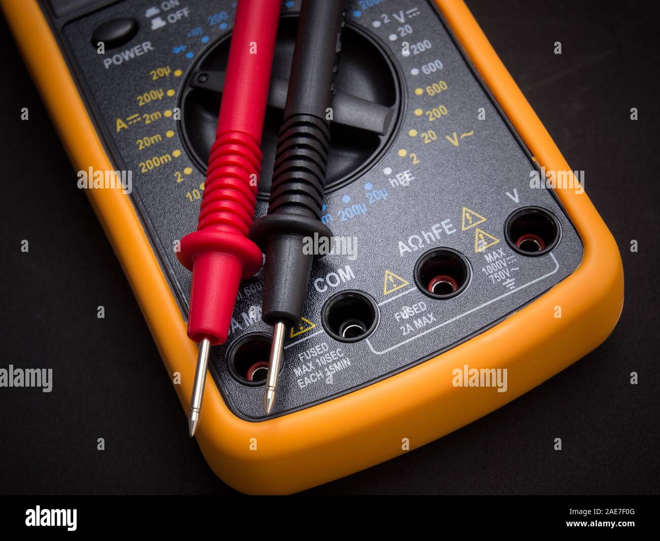Multimeter and tester closeup on black background Stock Photo - Alamy