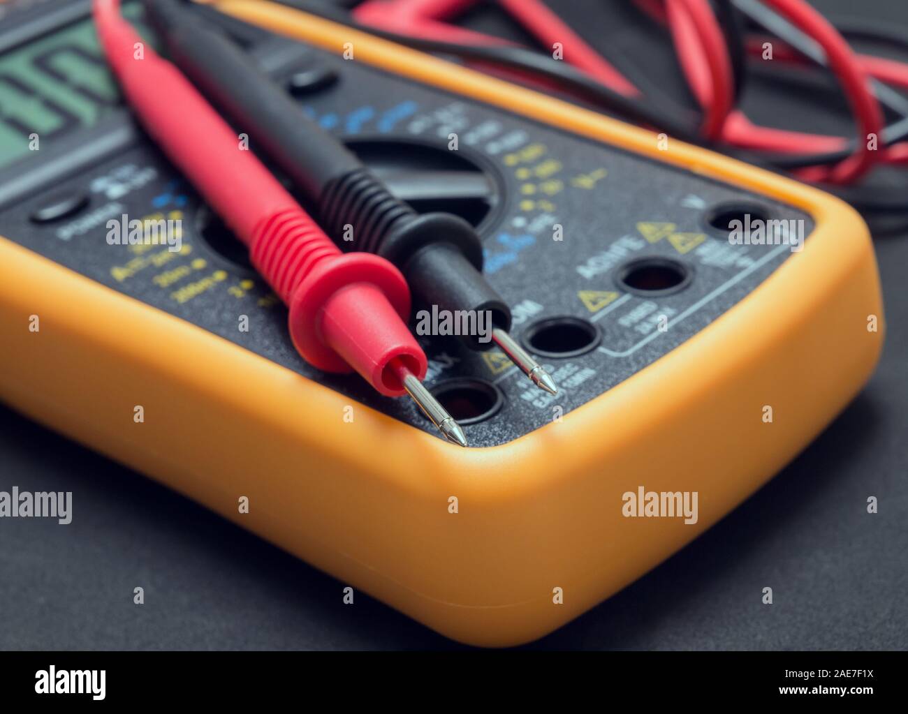 Multimeter and tester closeup on black background Stock Photo - Alamy