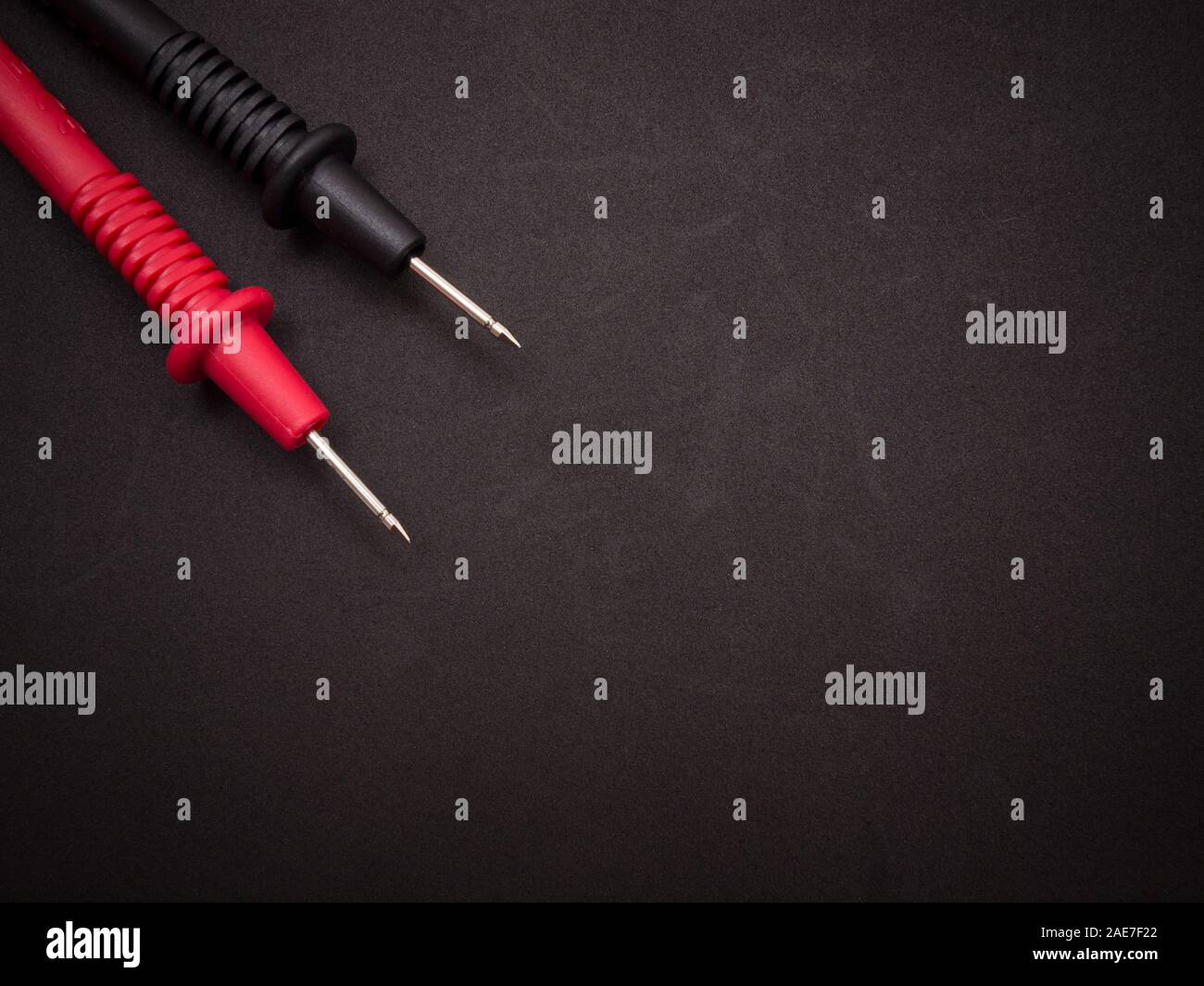 calipers or tester of multimeter on black background Stock Photo - Alamy