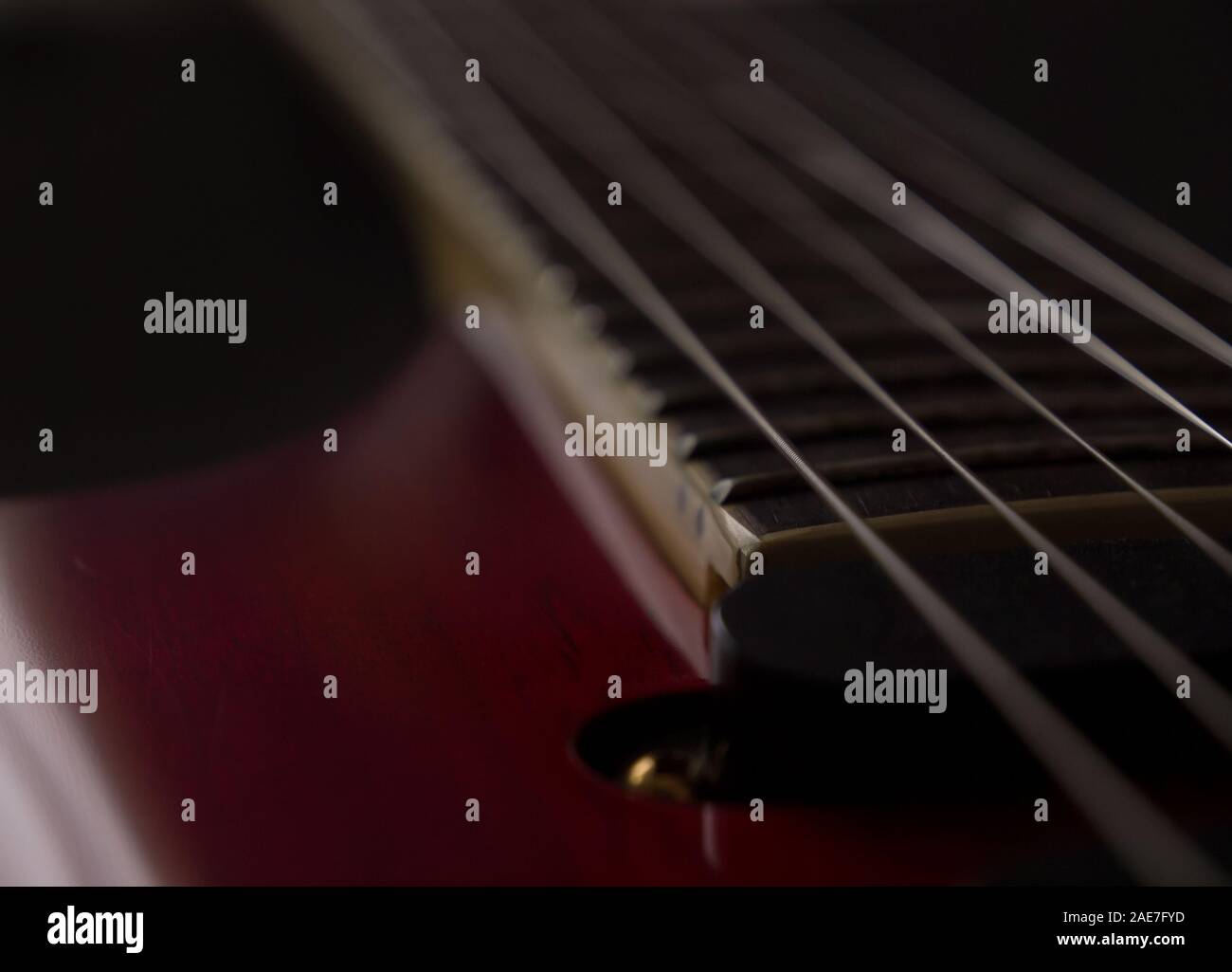 Detail of old electric guitar in low key light Stock Photo - Alamy