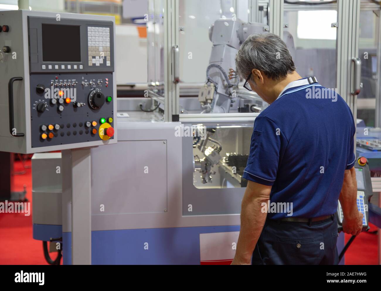 Worker control compact CNC lathe with robotic loading workpiece Stock ...