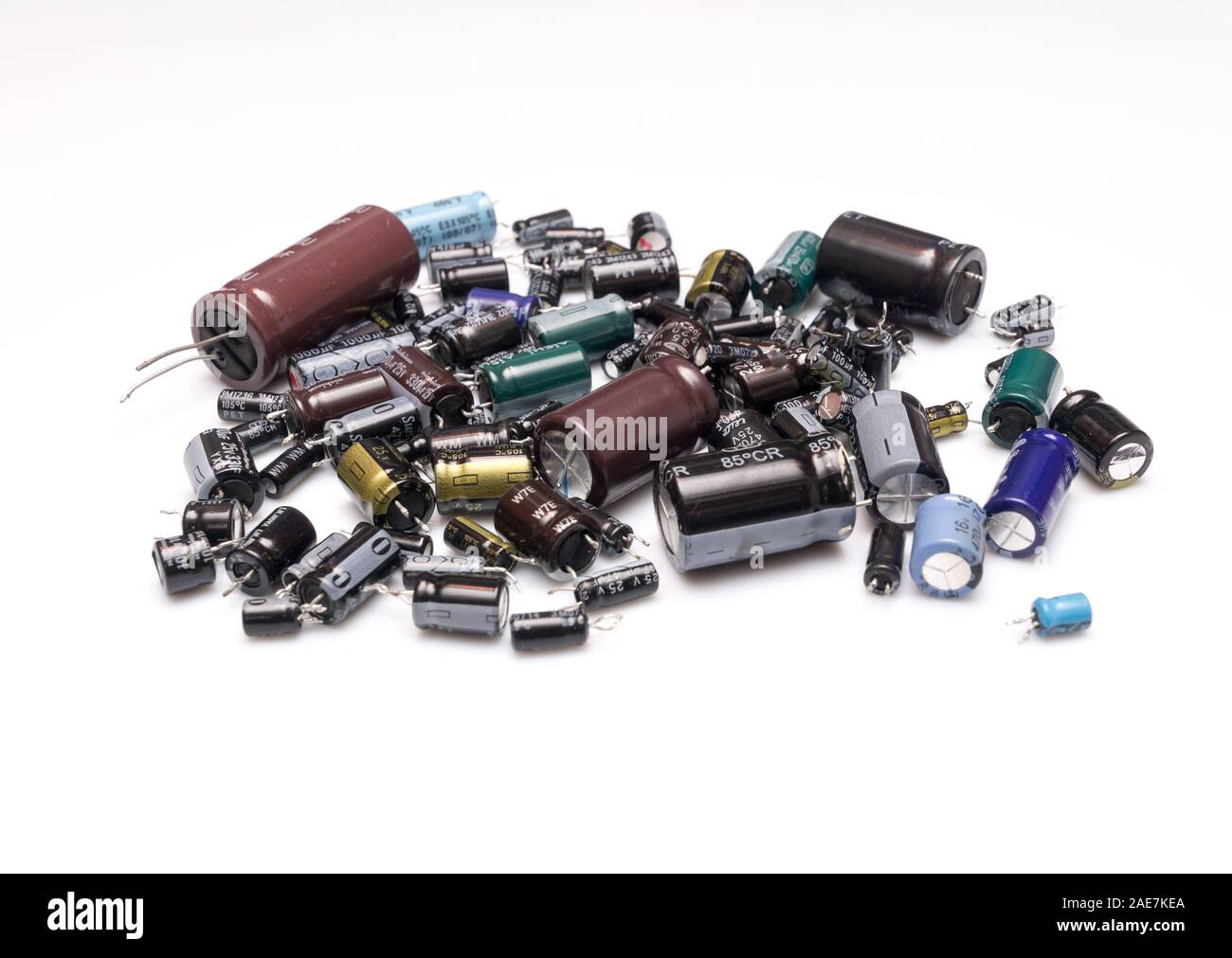 Old electrolitics capacitors isolated in white background selective ...