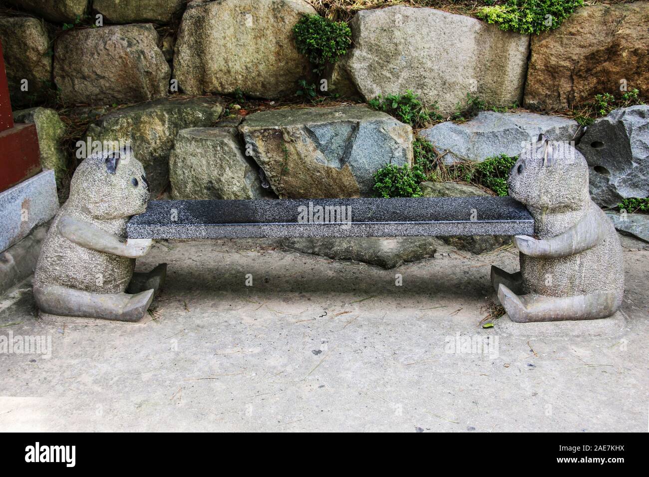 Stone bench near the entrance to Haedong Yonggungsa Temple in Busan ...