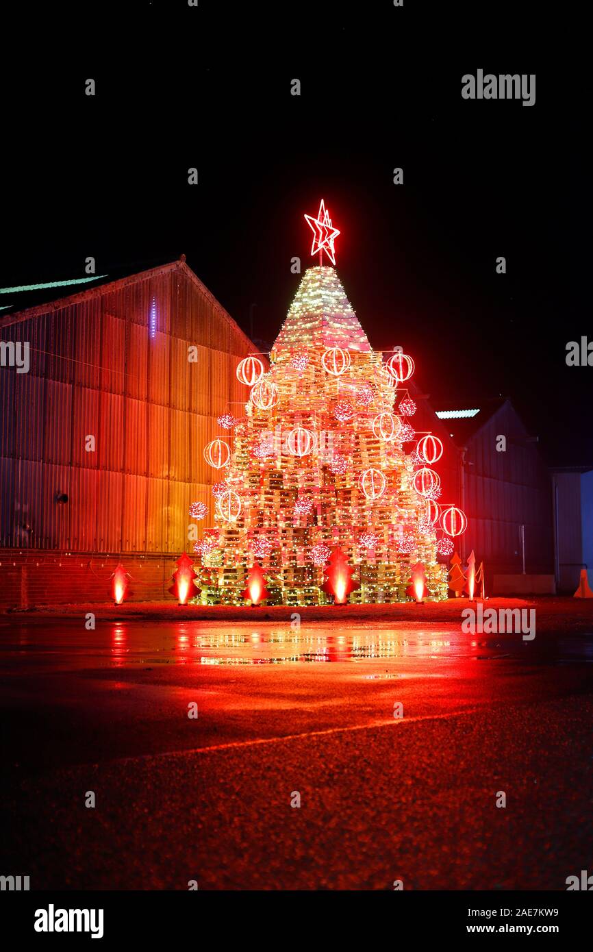 An innovative Christmas Tree, made from pallets of wood. This is ...
