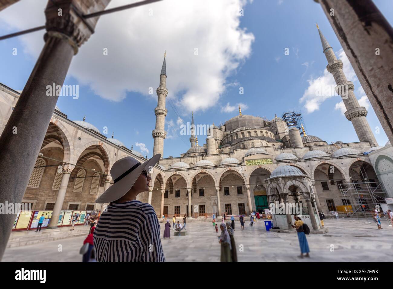 Beautiful girl in a white hat with his back to the audience at The Blue ...