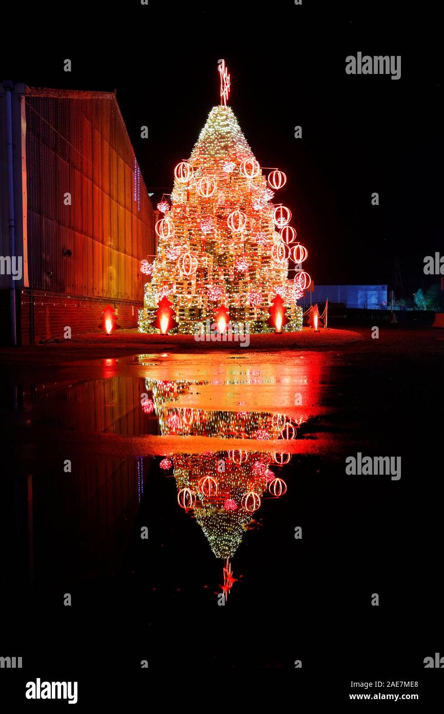 An innovative Christmas Tree, made from pallets of wood. This is ...