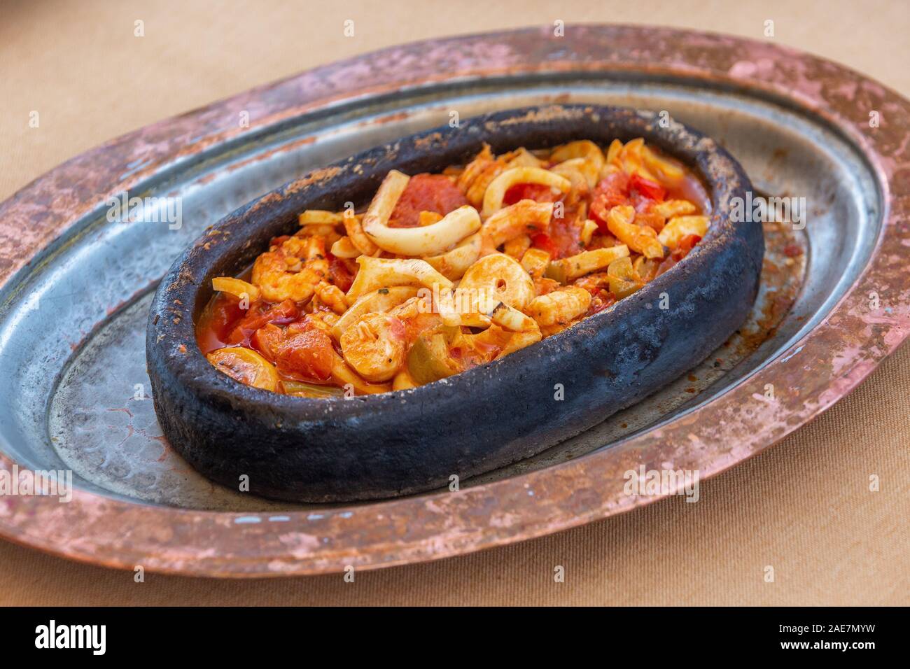 Deep fried octopus in tomato sauce on a plate at Istanbul, Turkey Stock ...
