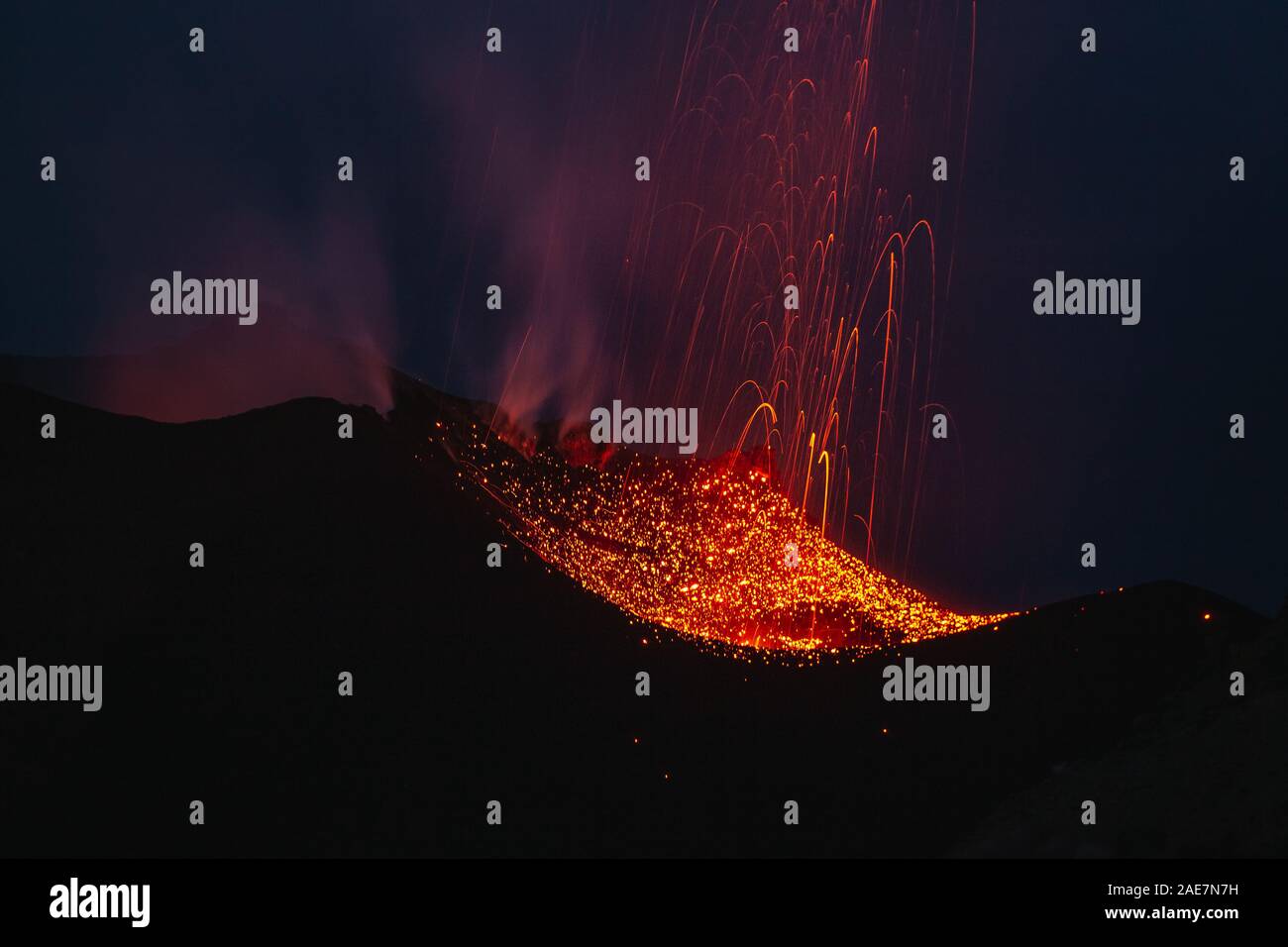The eruption of active volcano Stromboli spraying lava into the night ...