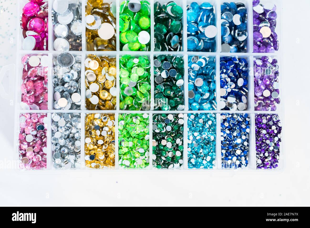 Color and size variety of rhinestones in the craft box Stock Photo - Alamy