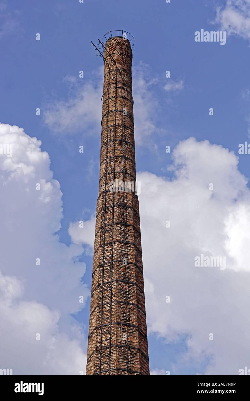 Old factory tall bricks chimney with ladder Stock Photo - Alamy