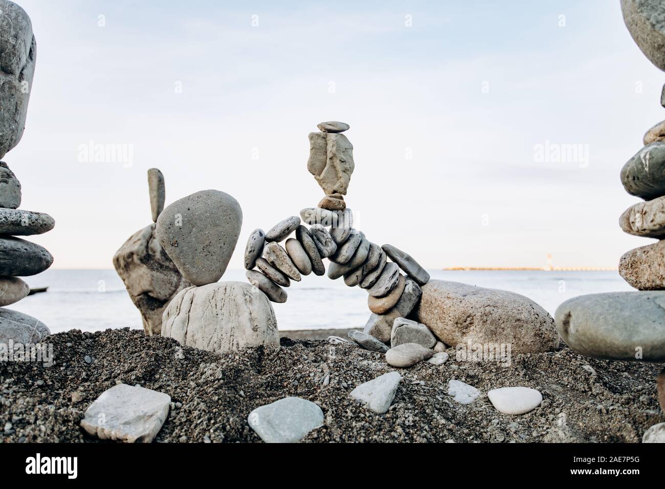 Figures of stones on the beach near the sea. Sea background and stone ...