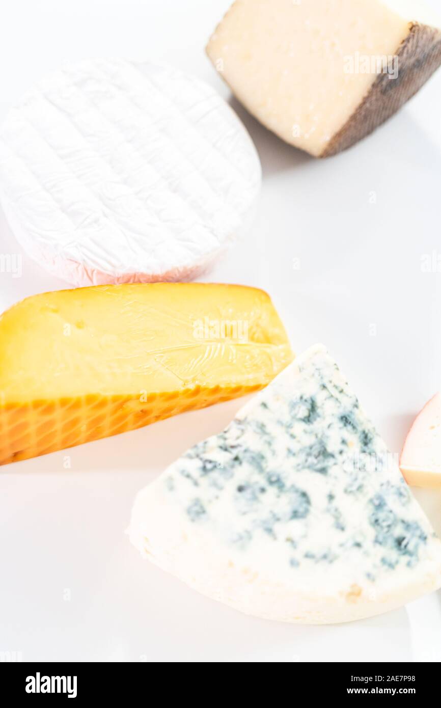Variety of large wedges gourmet cheese on a white background Stock ...