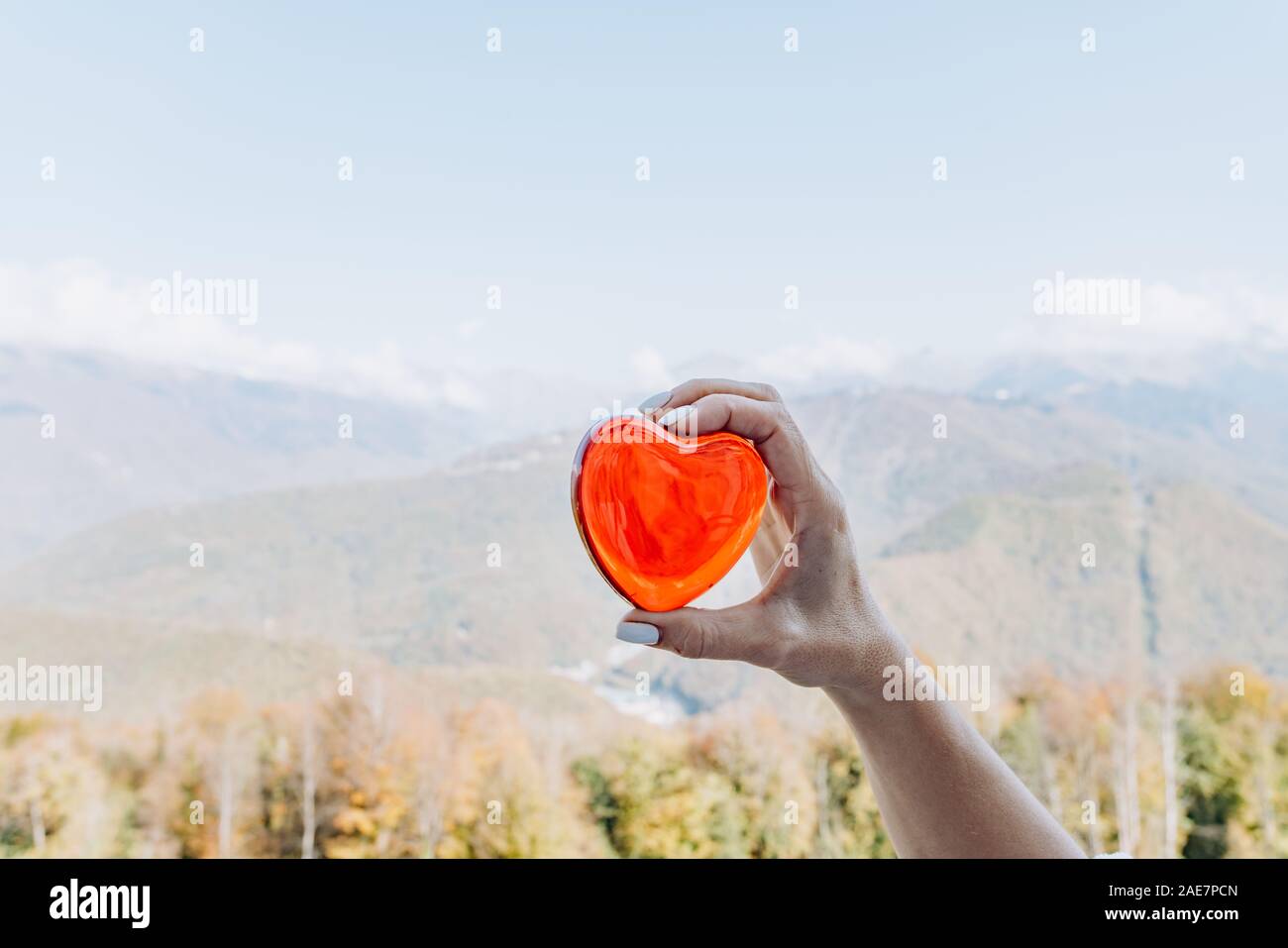 Person Holding Heart With Scenic Panorama Mountain Stock Photo - Alamy