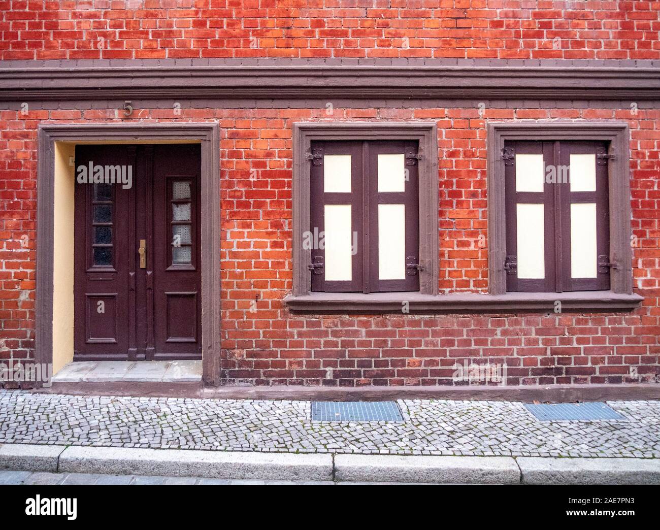 Facade of traditional red brick building in historic Altstadt ...
