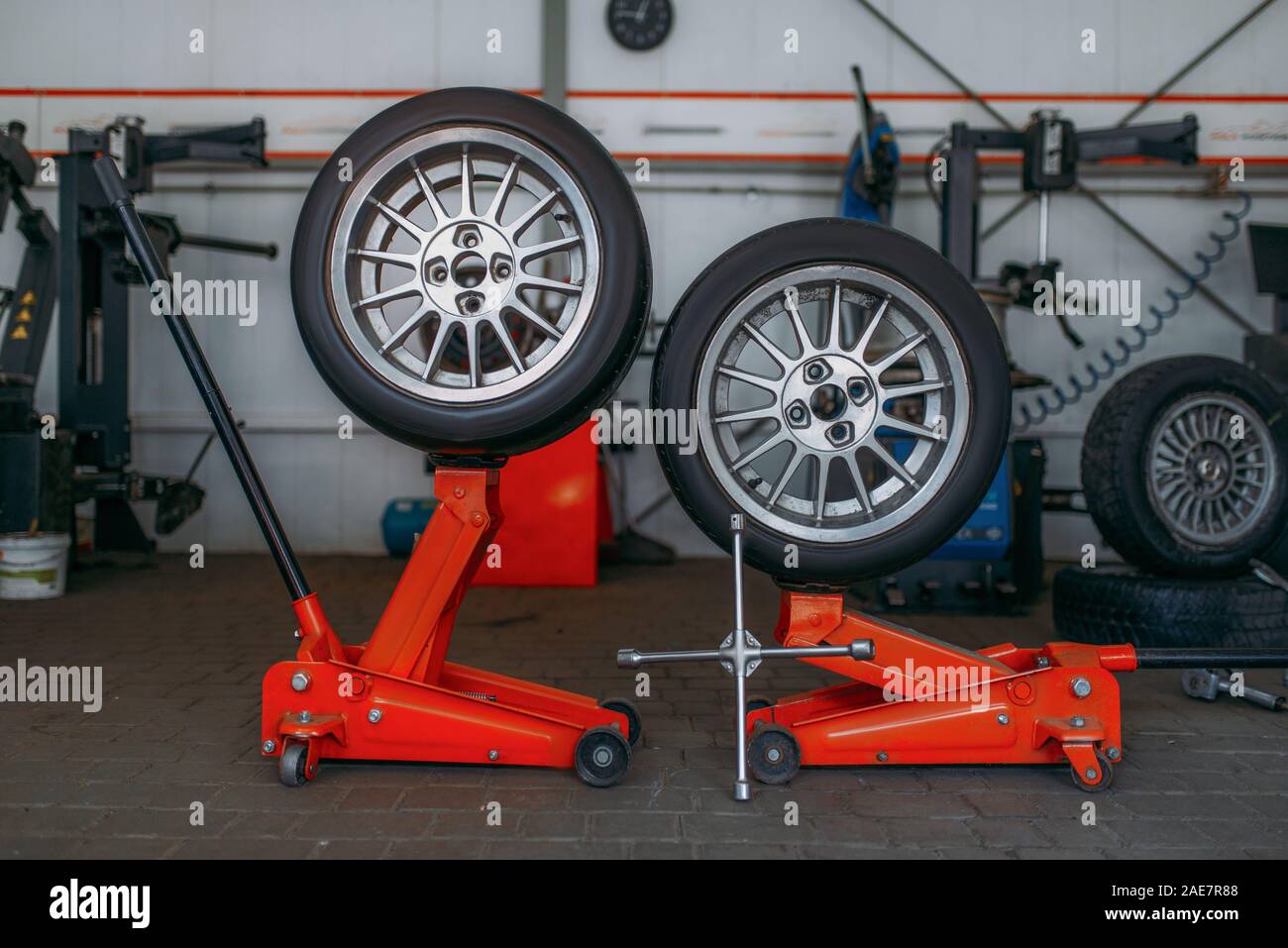 Car wheels, tire fitting machine, pneumatic wrench Stock Photo - Alamy