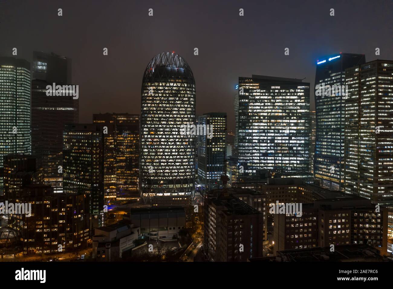 Aerial drone night shot of Skyscrapers with lights on in La Defense ...