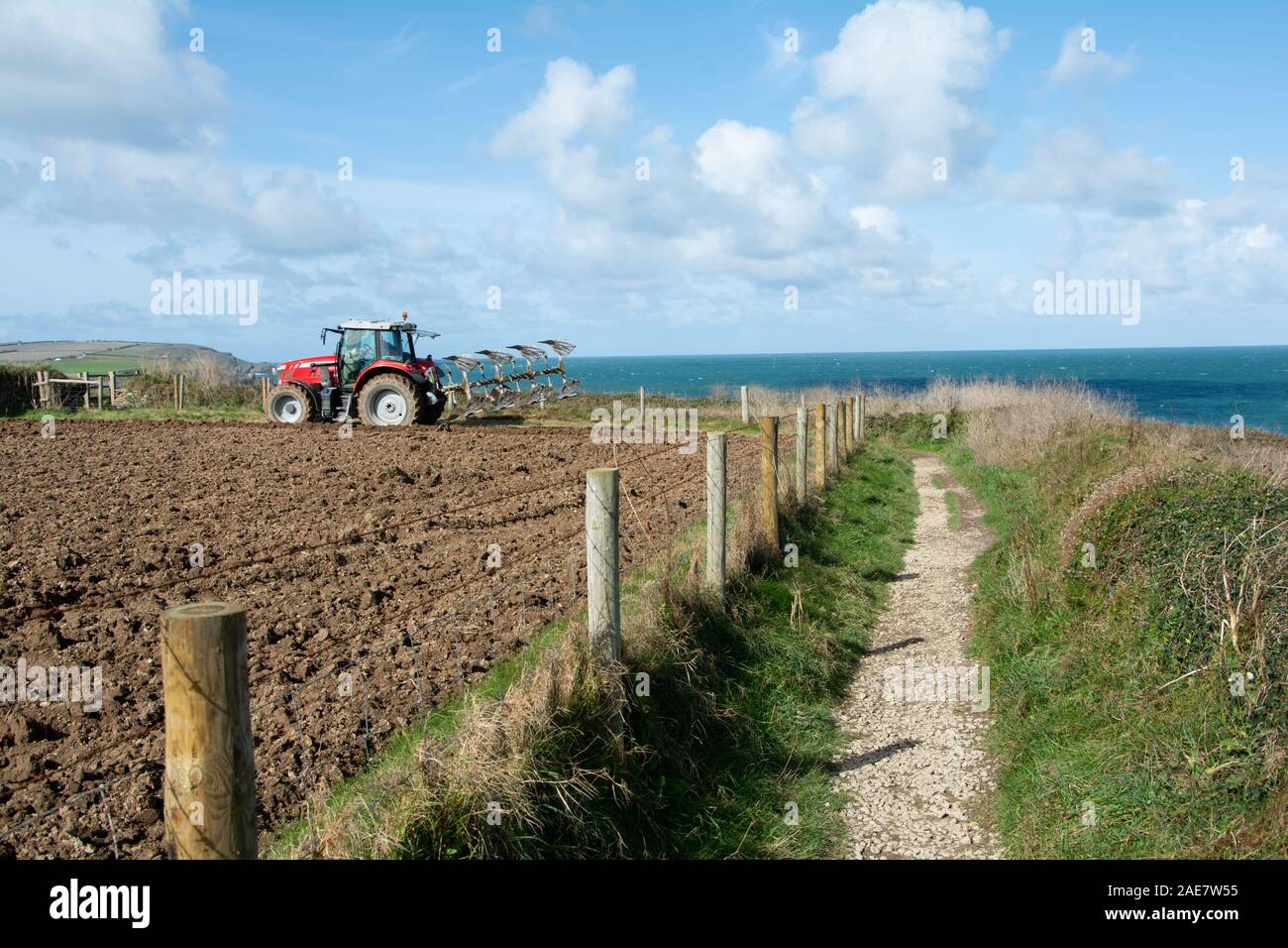 October 2019 - A farmer ploughs his field on a coastal farm in Trevose ...