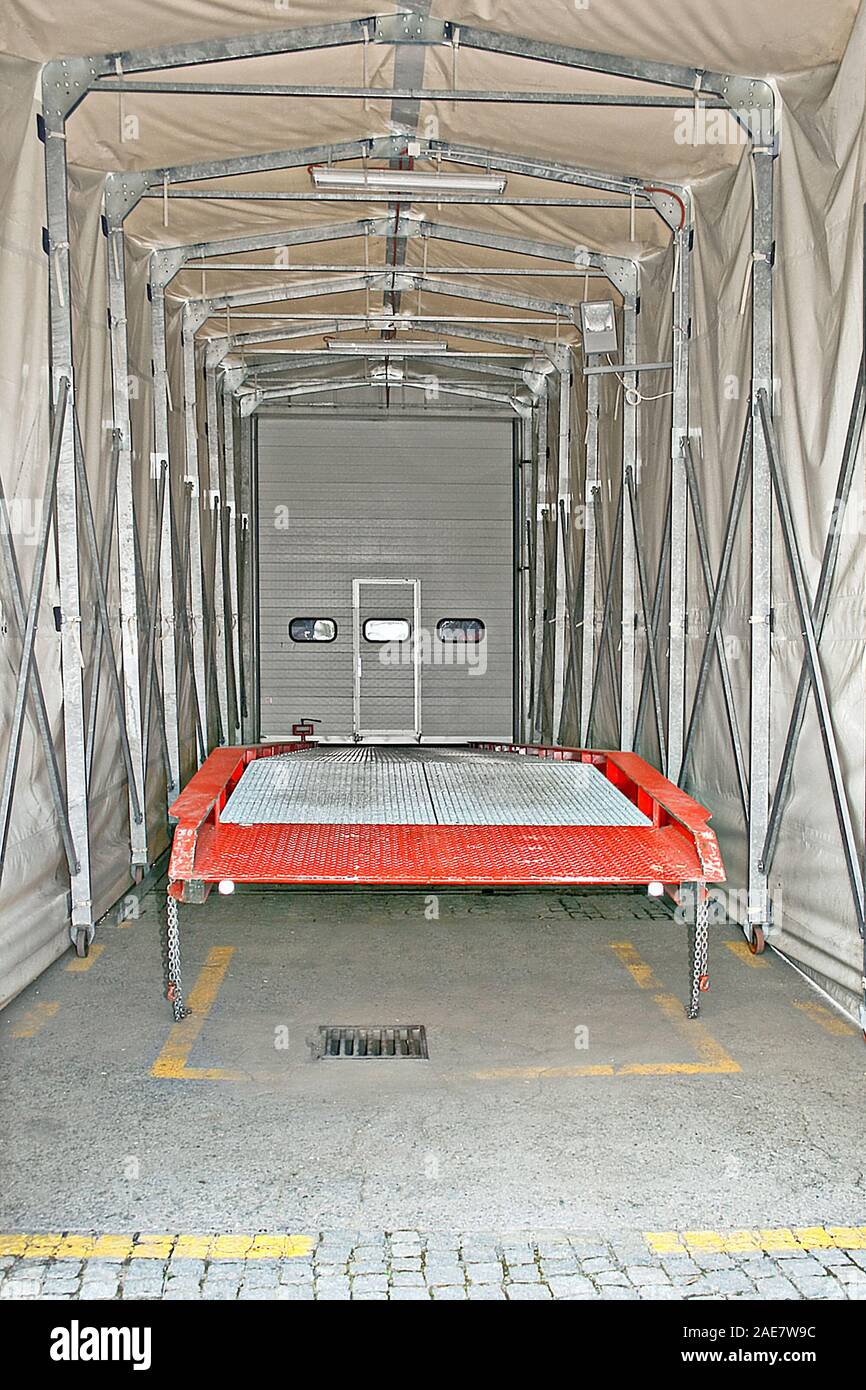 Cargo entrance with flexible tunnel and ramp Stock Photo - Alamy
