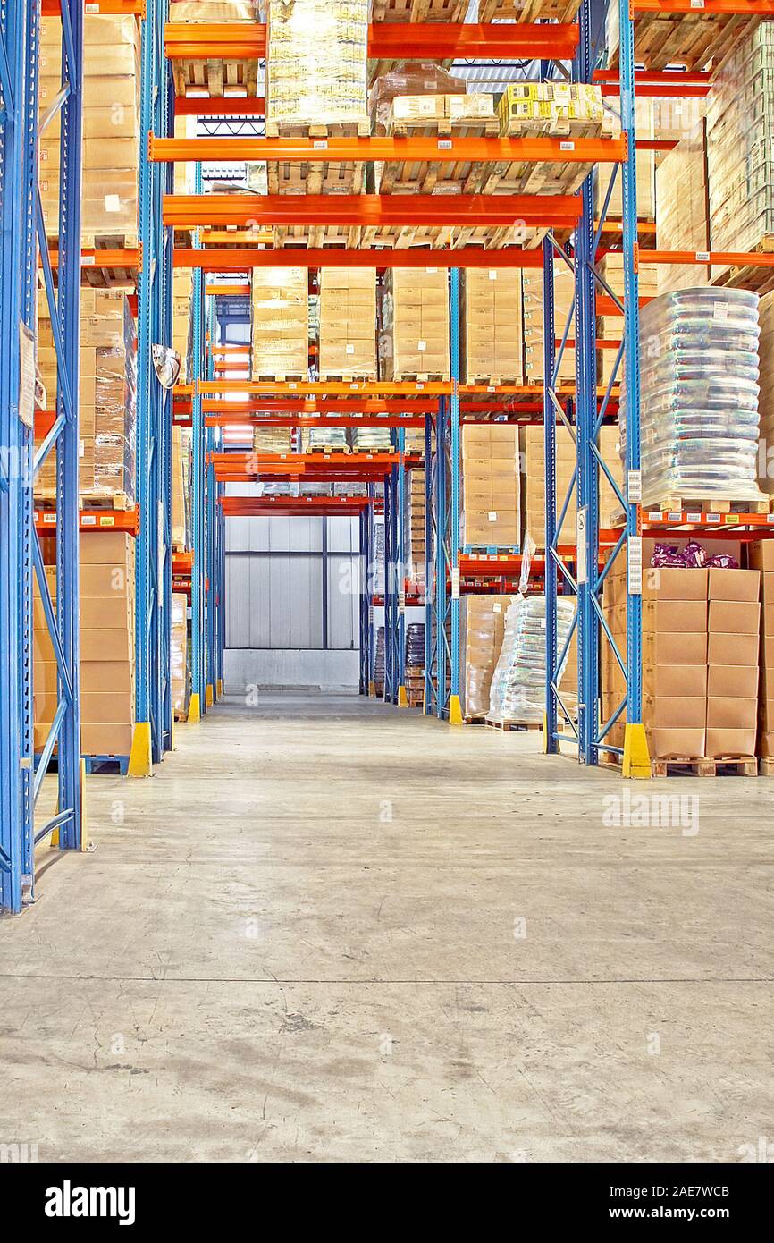 Big warehouse storage room with boxes and shelves Stock Photo - Alamy