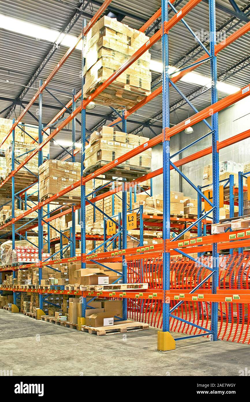 Big warehouse storage room with boxes and shelves Stock Photo - Alamy