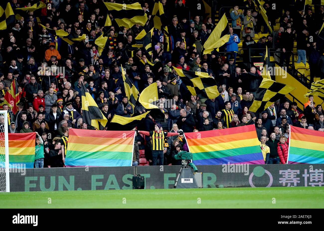 Watford fans hold up Rainbow flags before the Premier League match at ...