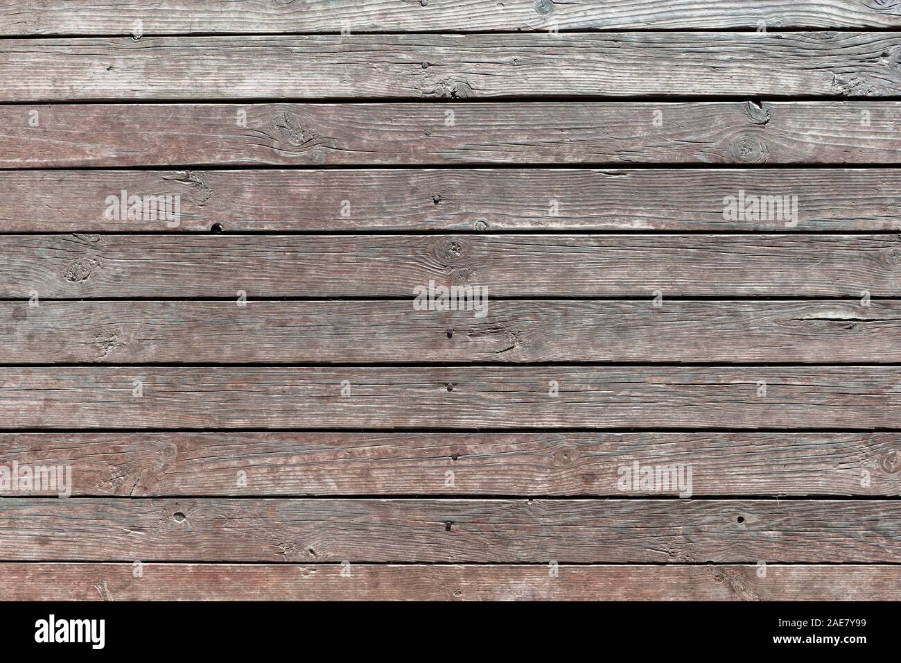 thin horizontal wooden texture wall of rural house. Old dirty panels ...