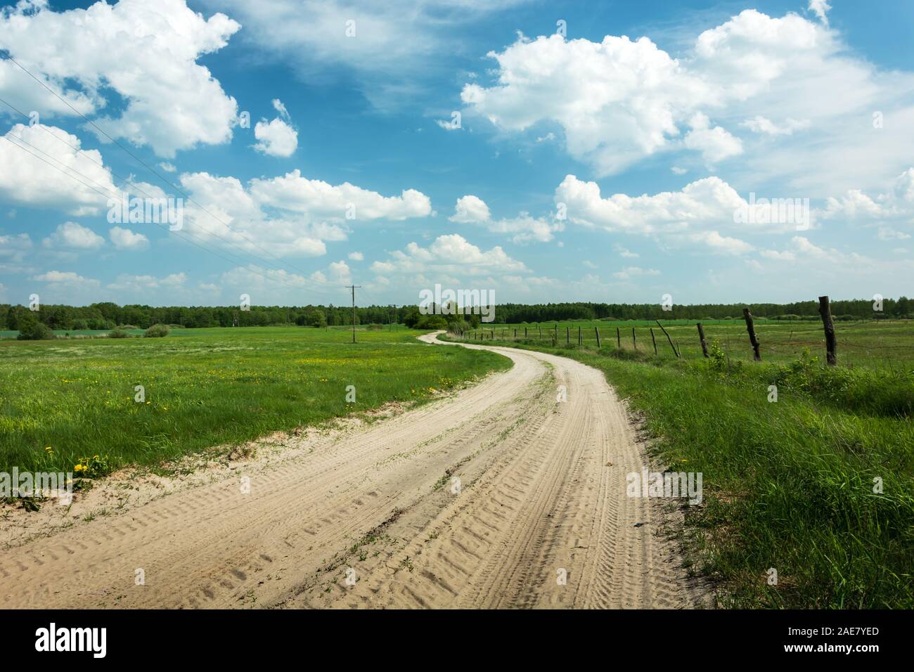 Sandy road with trees and clouds hi-res stock photography and images ...