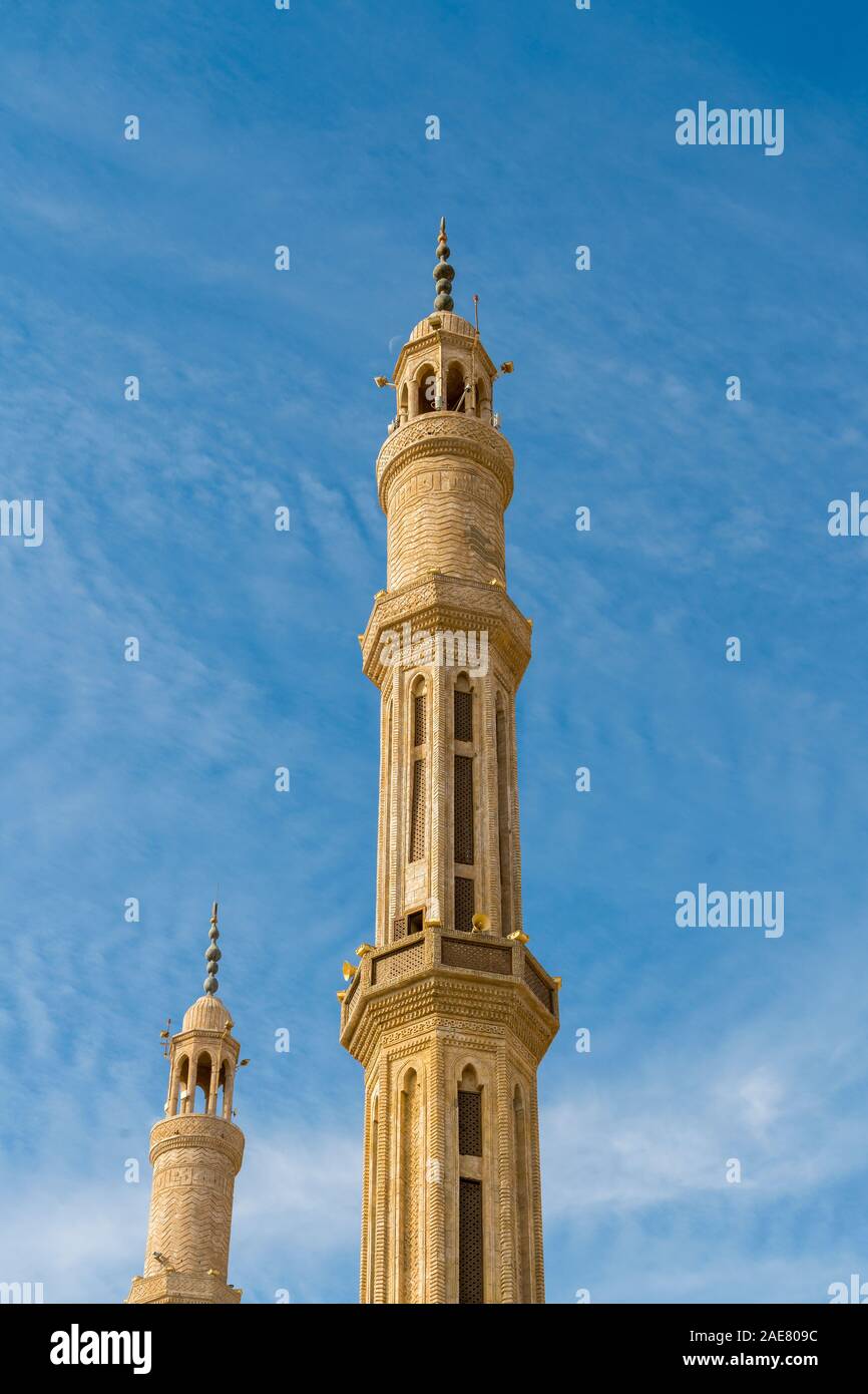 Minaret on a background of blue sky. Islamic faith concept. vertical ...