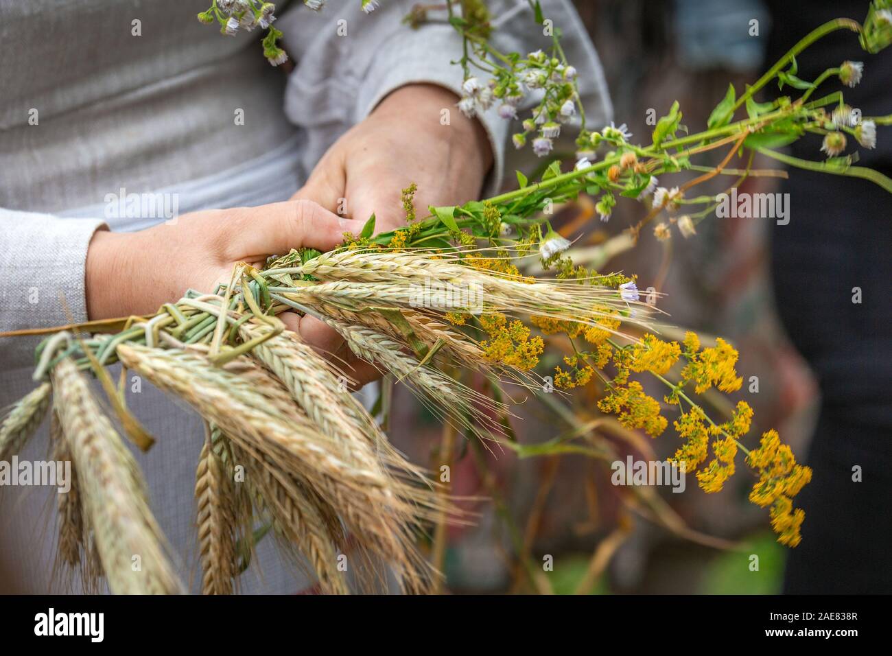 Making wreaths in Belarusian traditional clothes, celebrating the pagan ...