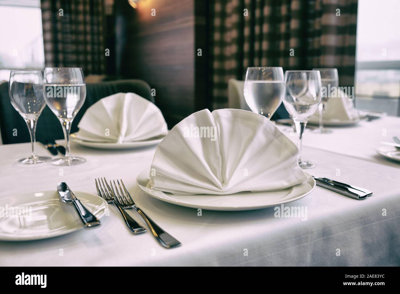 Table arrangement in an expensive haute cuisine restaurant, toned image ...