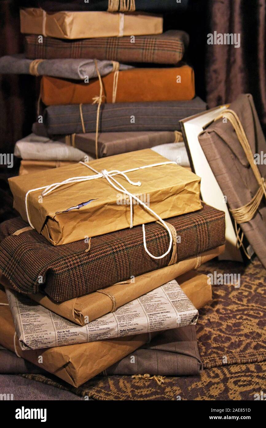 Big stack of gifts wrapped in recycled paper Stock Photo - Alamy