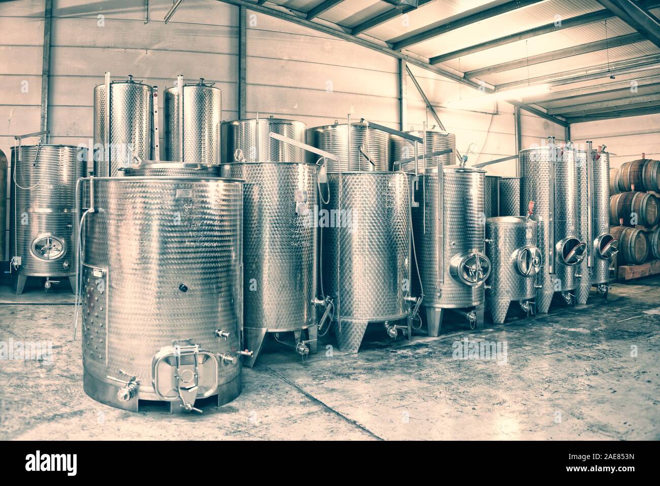 Fermentation stainless steel vats in a winery, toned Stock Photo - Alamy