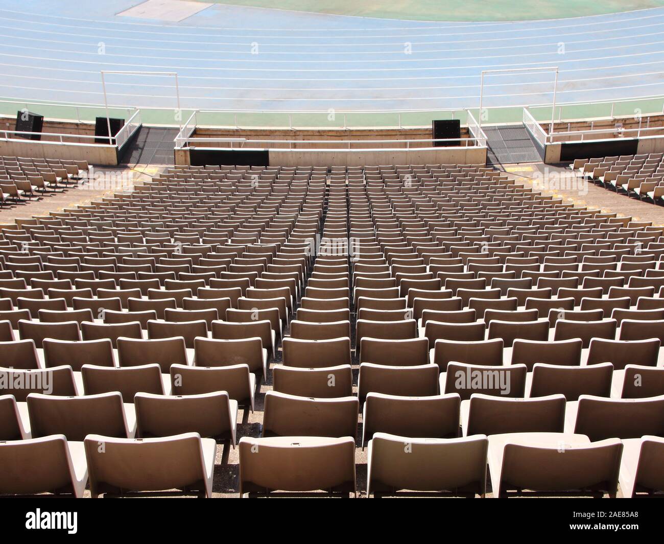 Perspective of Spectator Seats at Sports Arena with Blue Running Lanes ...