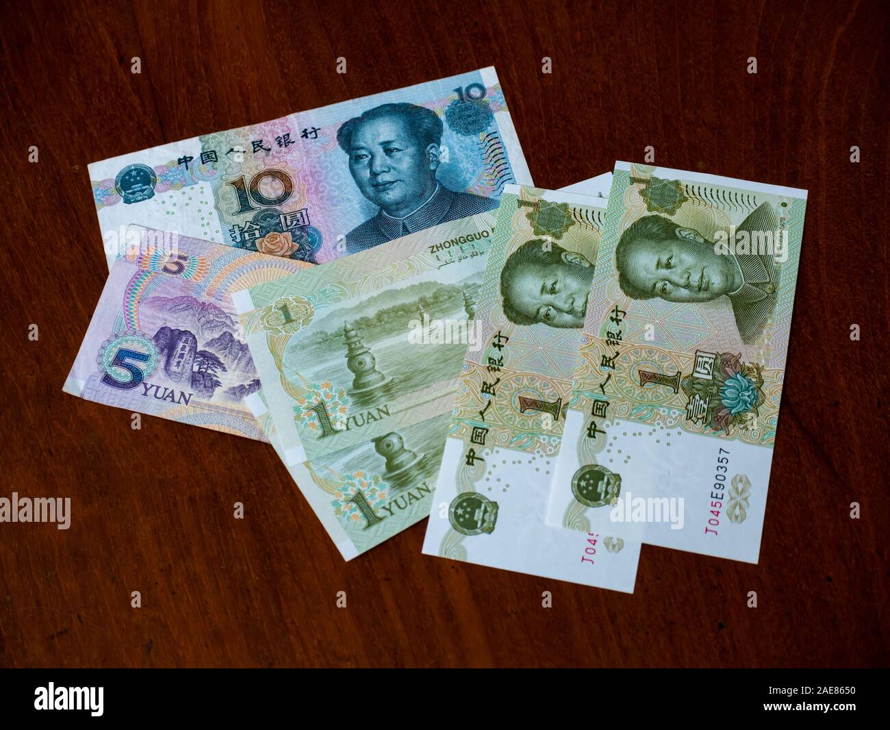 Chinese Yuan money paper banknotes with ten, five and one yuan bank ...