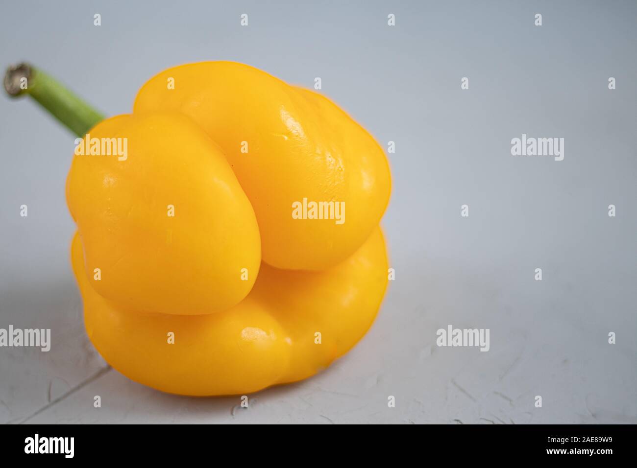 Ugly organic vegetables. Deformed home bell pepper on a light ...